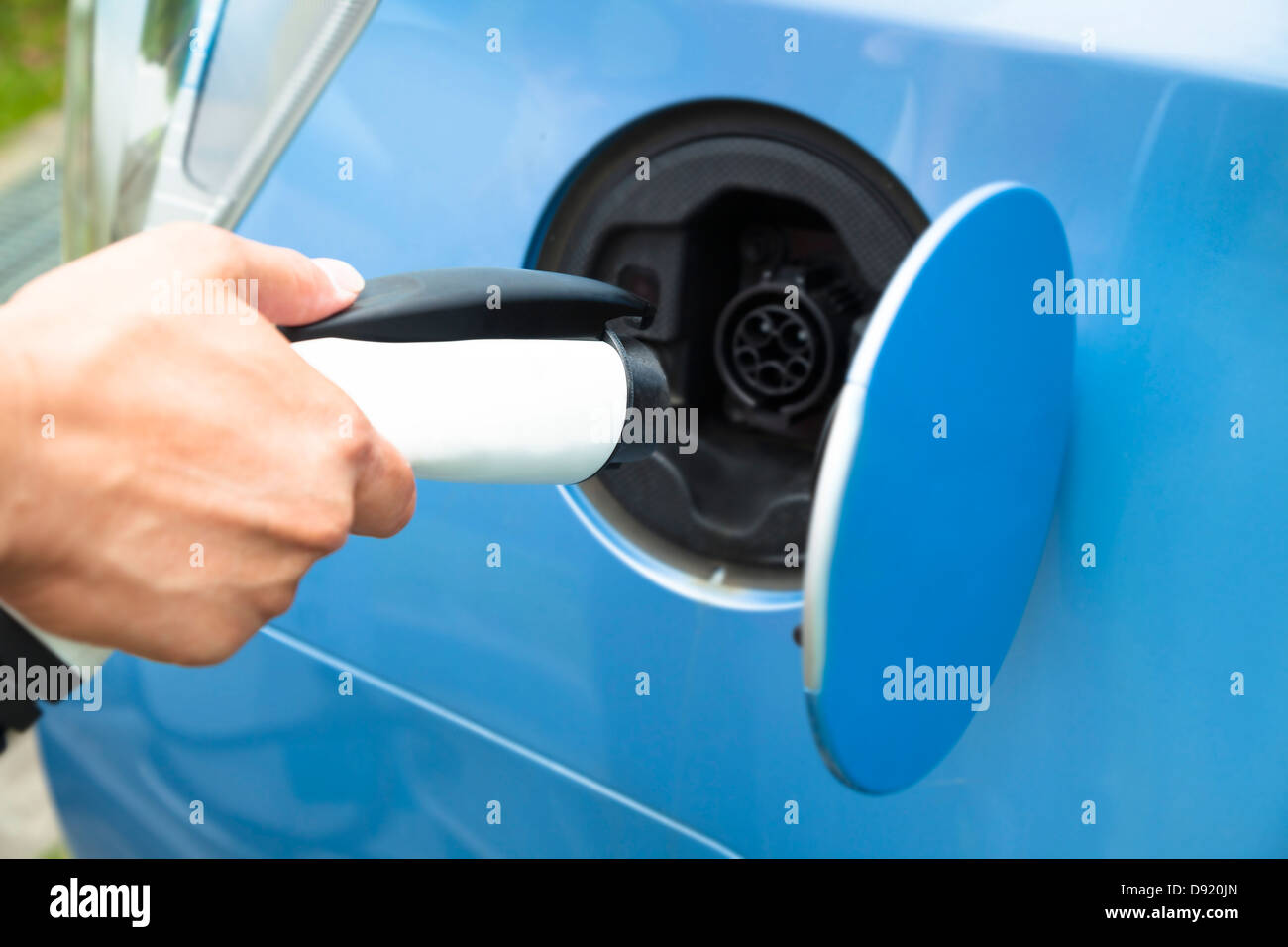 Hand holding car charger hi-res stock photography and images - Alamy