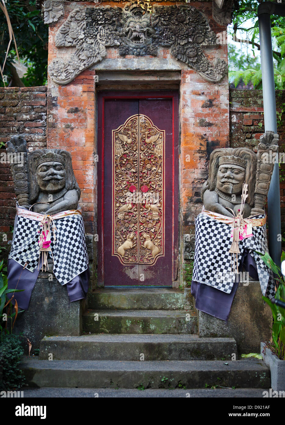 The gates of the old temple and stone guards. Indonesia, Bali Stock ...