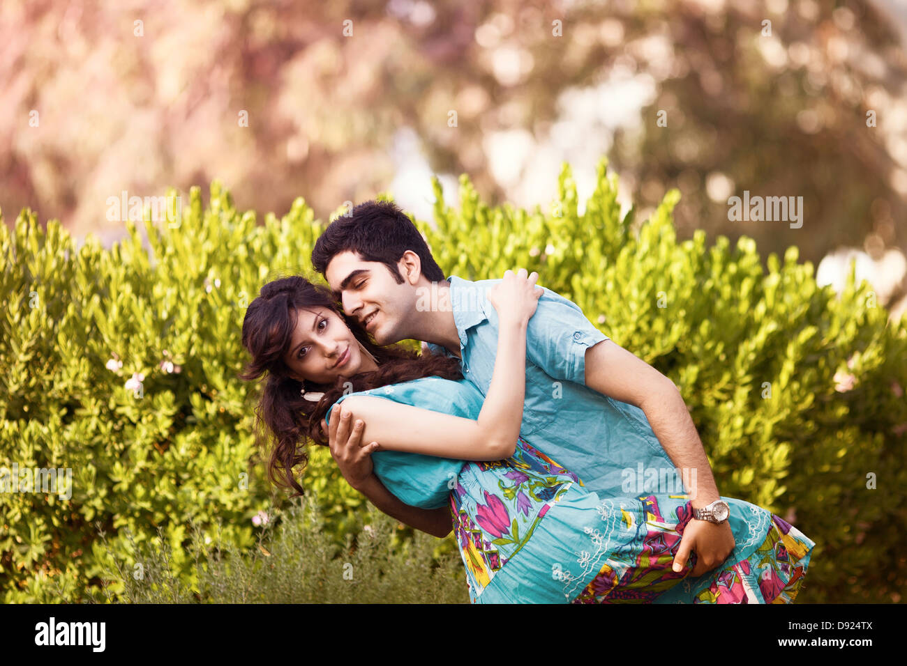 young couple in love cuddling in the park, circling in the dance Stock ...