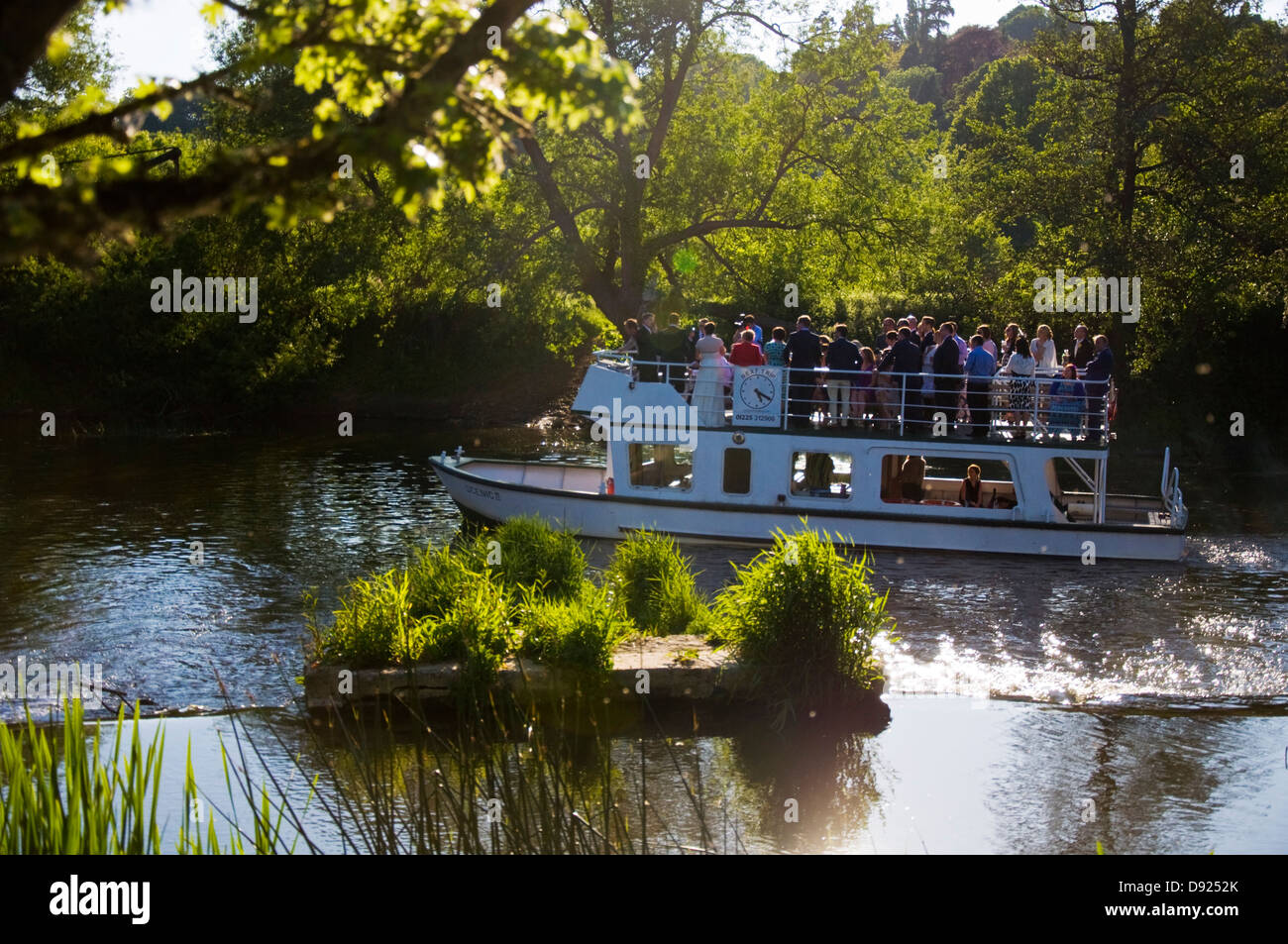 Summer evening cruise on the River Avon at Bathampton weir Somerset ...