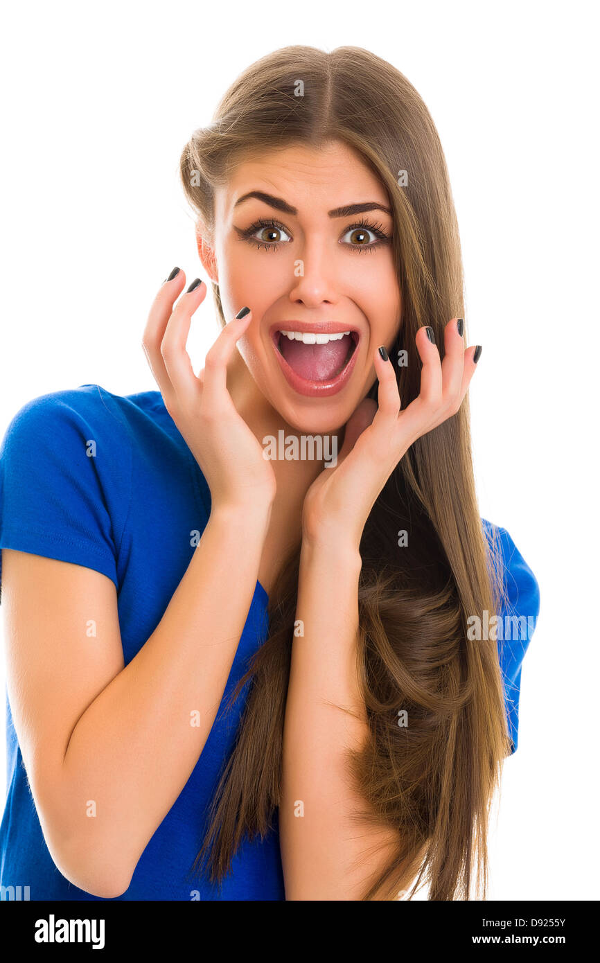 Portrait of a beautiful young woman with a shocked facial expression ...