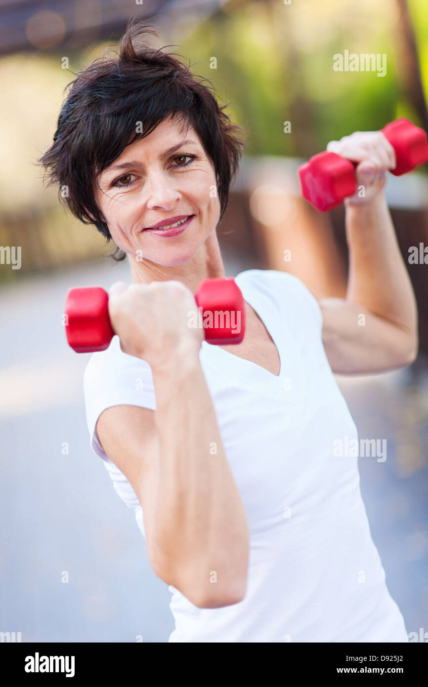 middle aged woman workout with dumbbells Stock Photo - Alamy