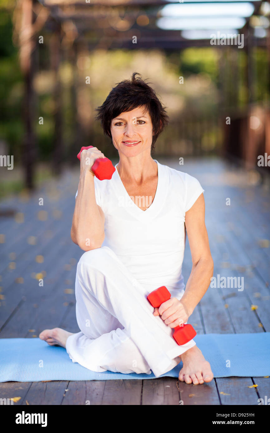 active middle aged woman exercise with dumbbells Stock Photo - Alamy