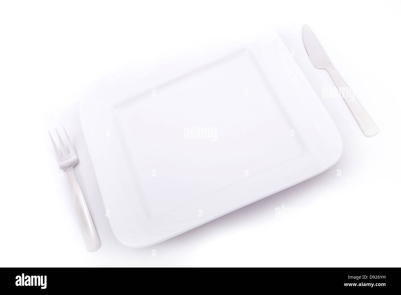 A blank plate isolated on white Stock Photo - Alamy