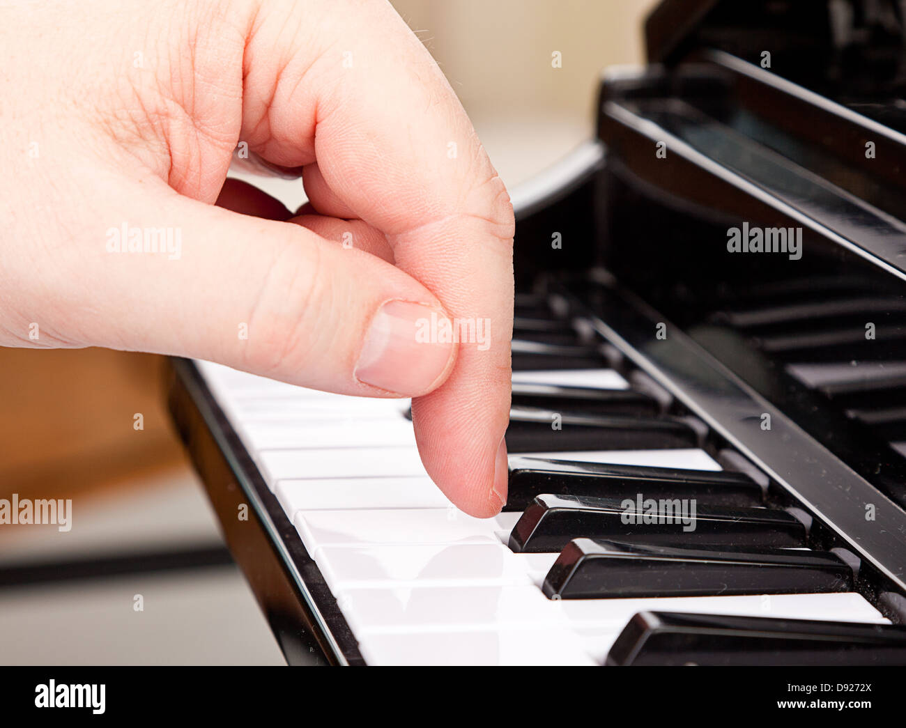 arm bent over the keyboard musical instrument Stock Photo - Alamy