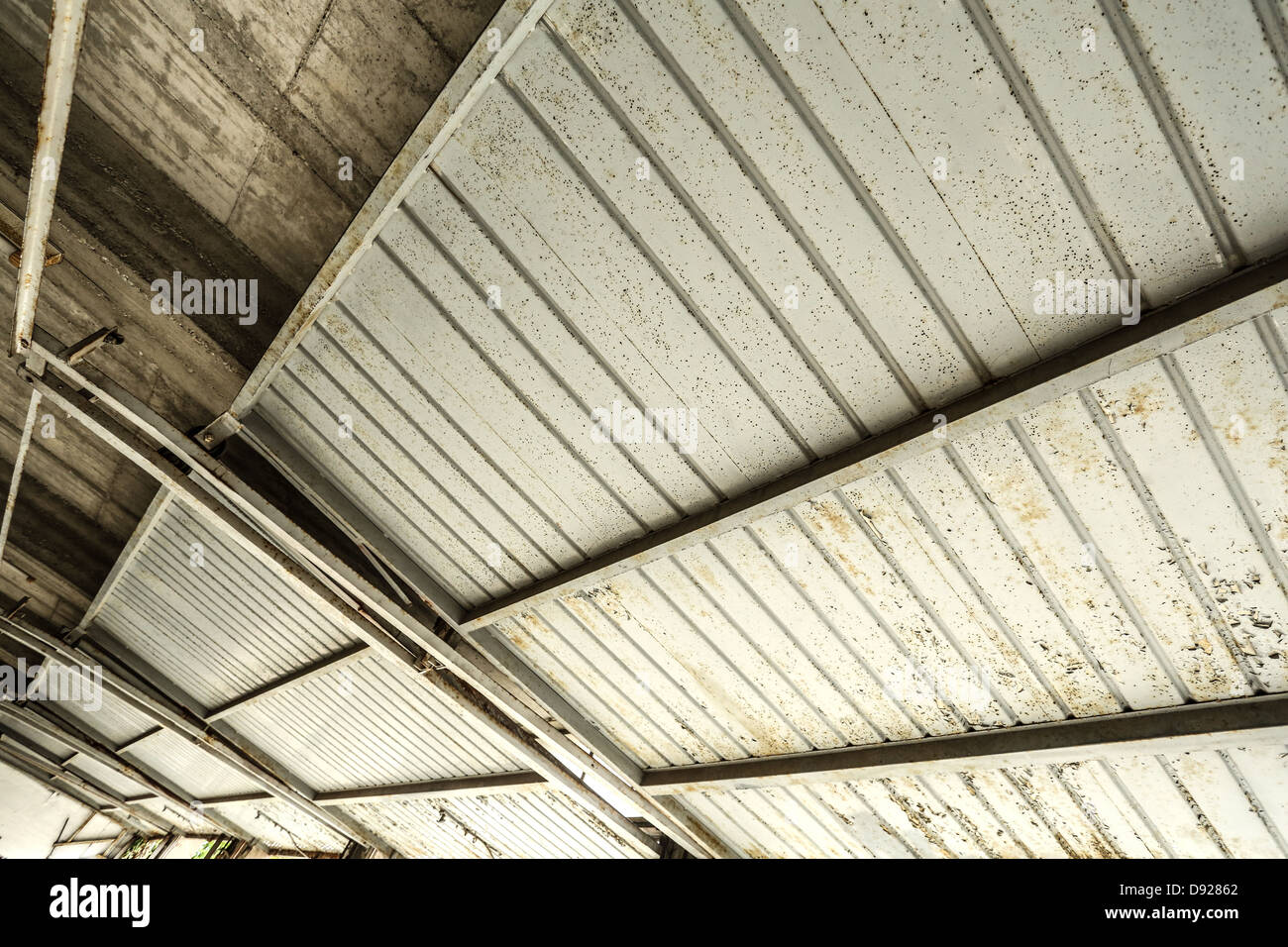 A industrial garage ceiling with open gates Stock Photo - Alamy