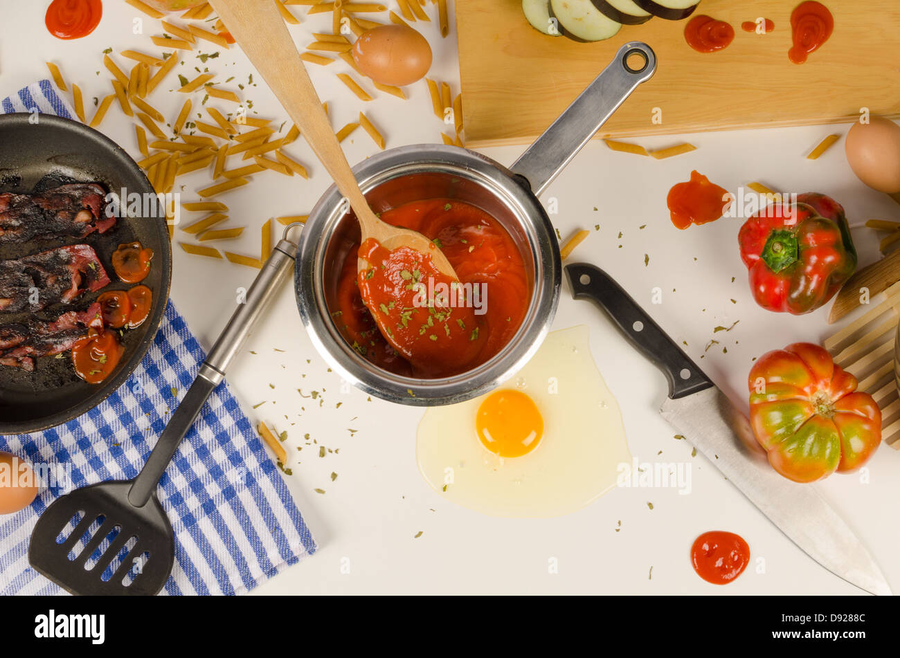 Chaotic kitchen table left by some untidy cook Stock Photo - Alamy