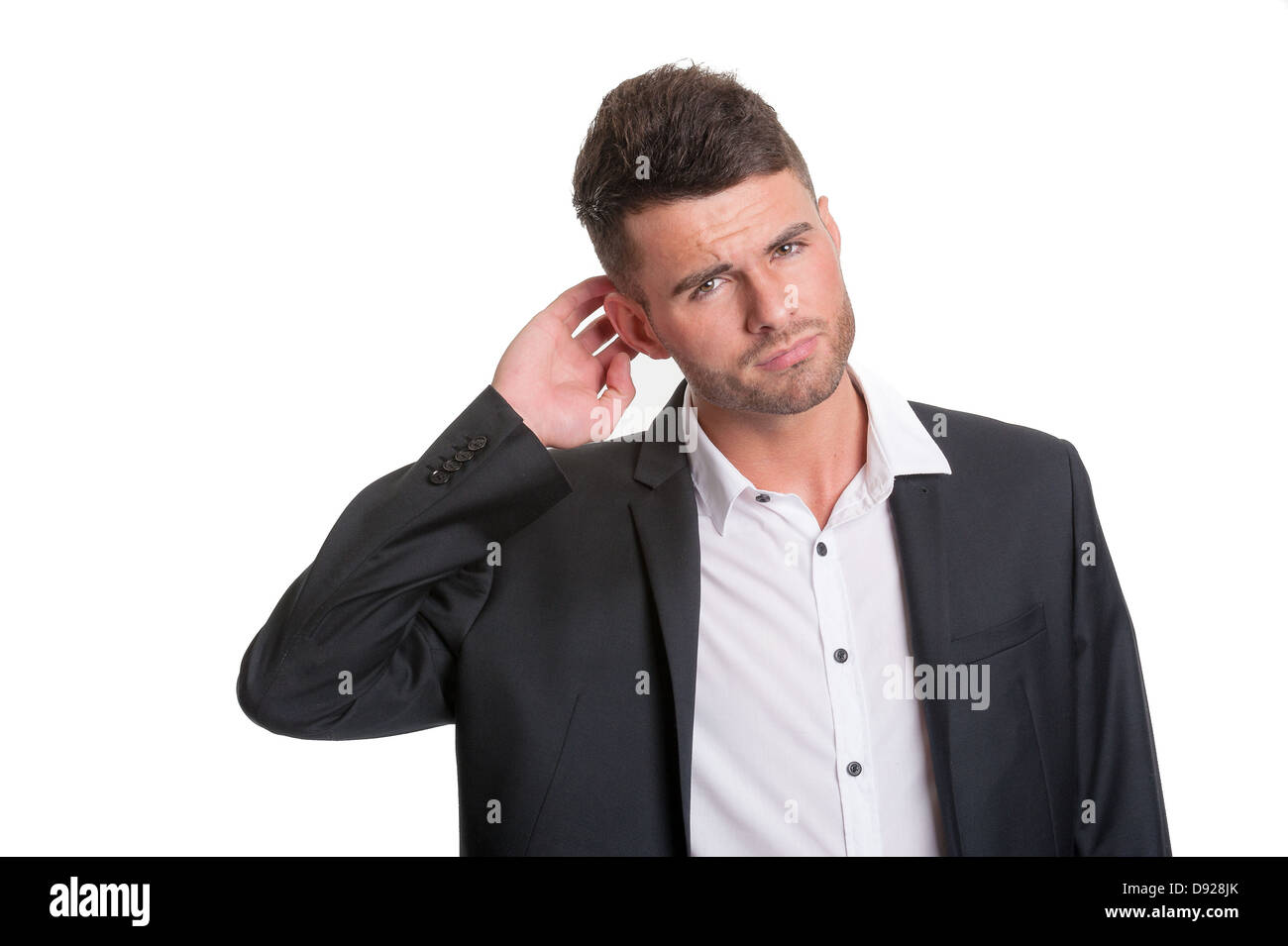Puzzled young business man scratches head, isolated on white Stock ...