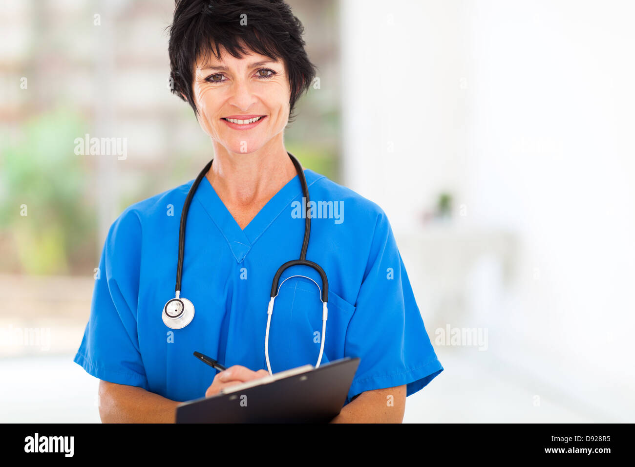 beautiful middle aged medical nurse in hospital office Stock Photo - Alamy