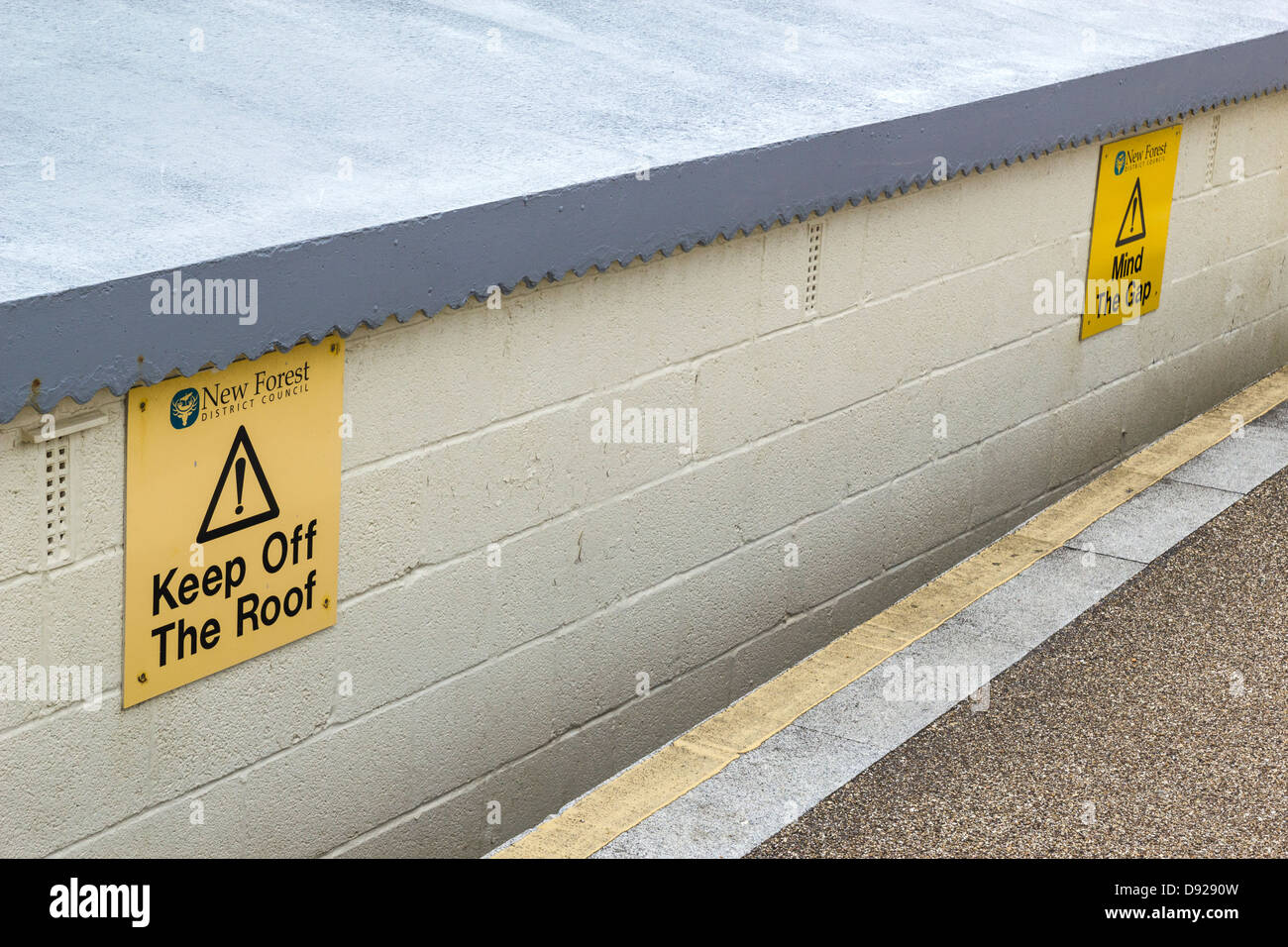 Keep Off The Roof and Mind The Gap Signs Stock Photo - Alamy