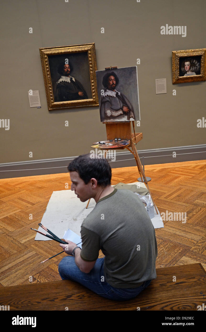 Young artist copying a painting in Metropolitan Museum of New York ...
