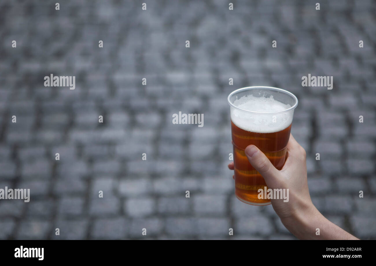 beer in right hand Stock Photo - Alamy