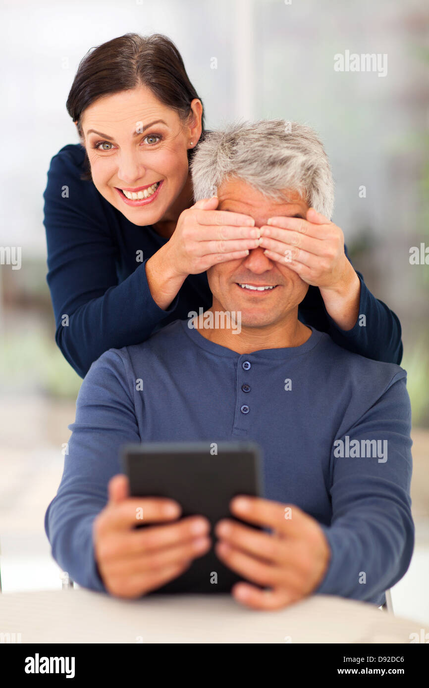 playful middle aged couple having fun at home Stock Photo - Alamy