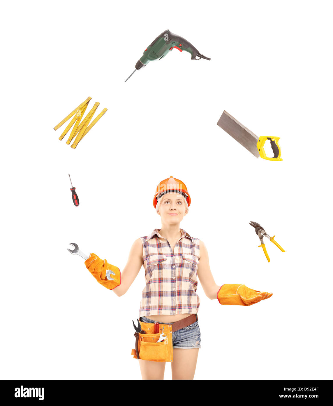 Female manual worker juggling with tools, isolated on white background ...