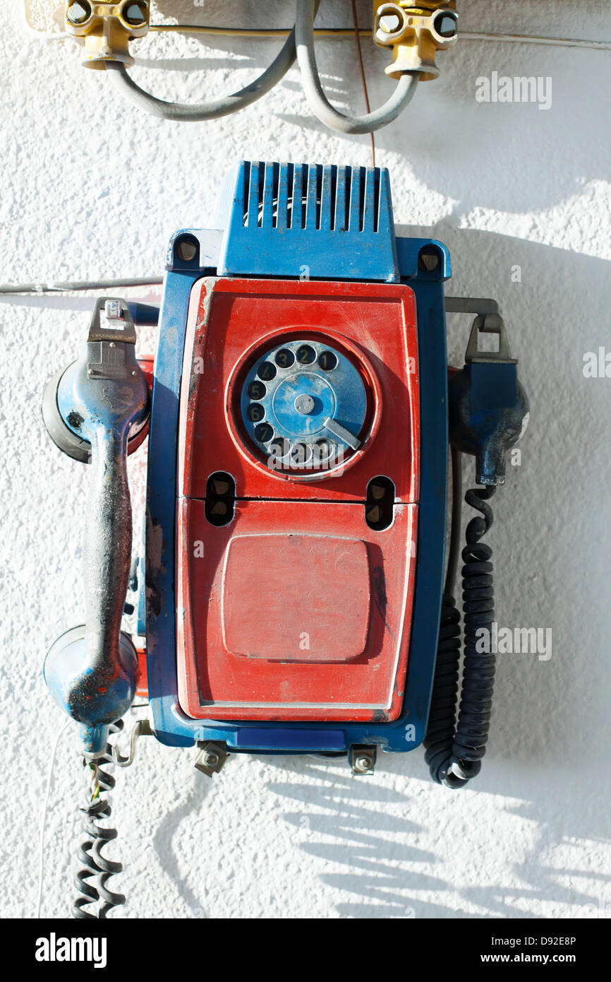 Old rotary phone on wall, close-up Stock Photo - Alamy