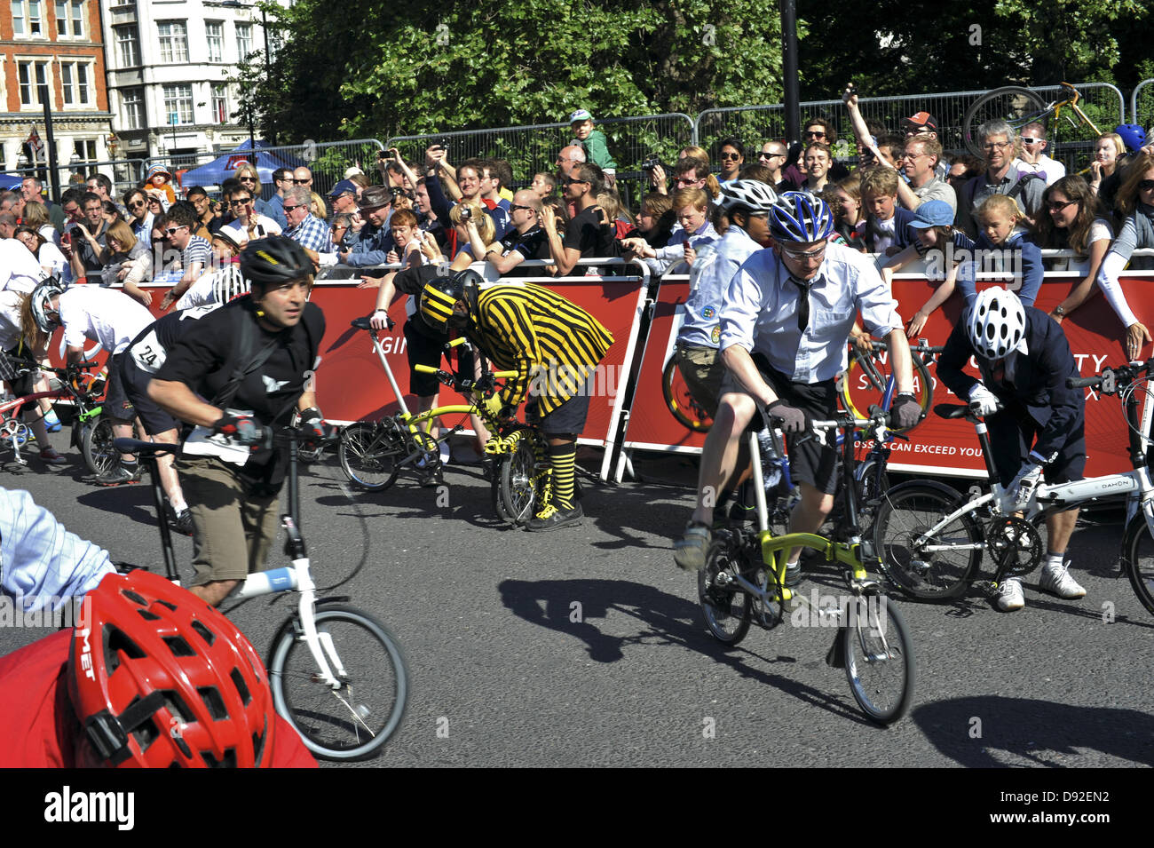 London, UK. Riders assembling their bikes and beginning to race at the ...