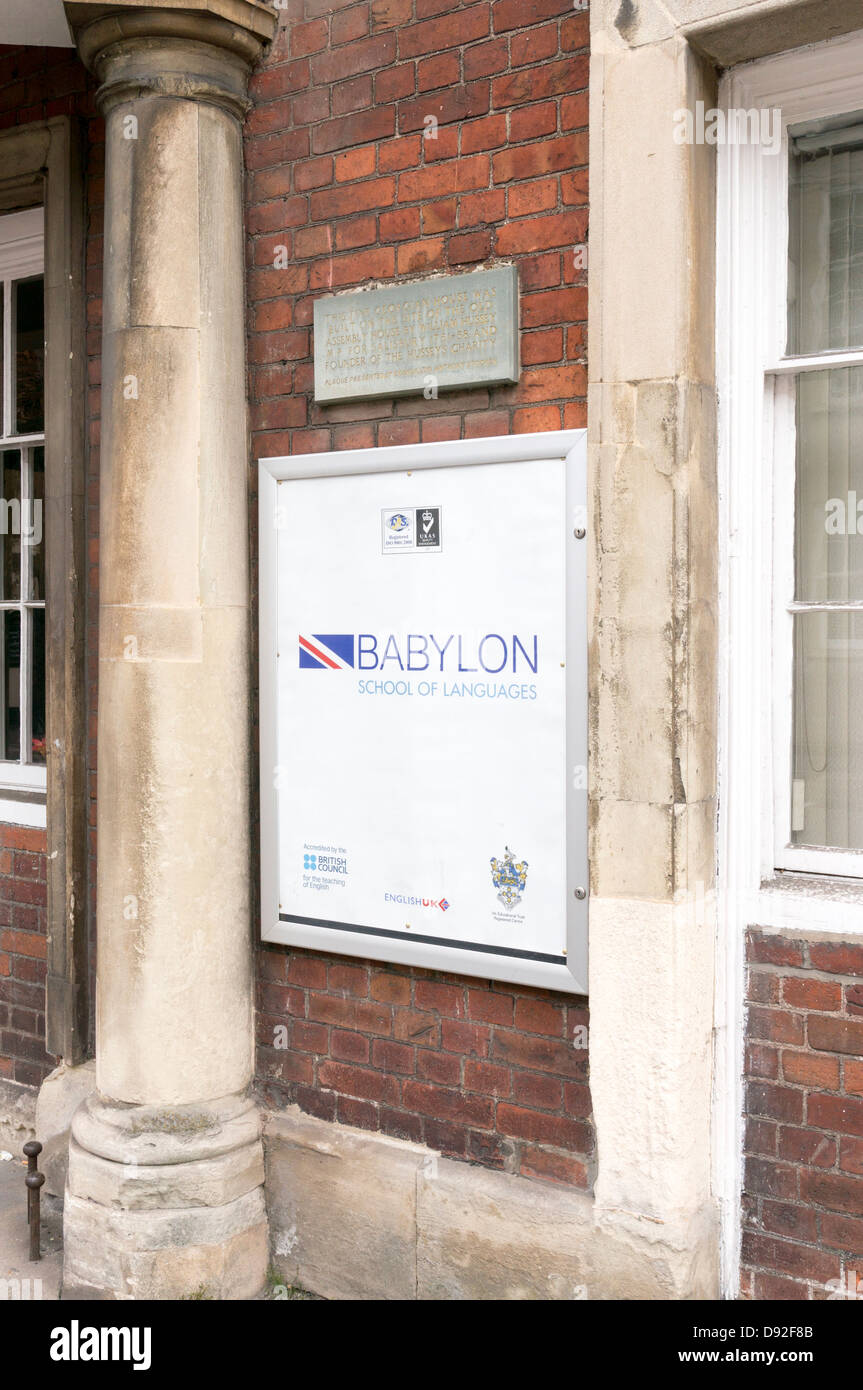 Poster sign on wall advertising language school Stock Photo - Alamy