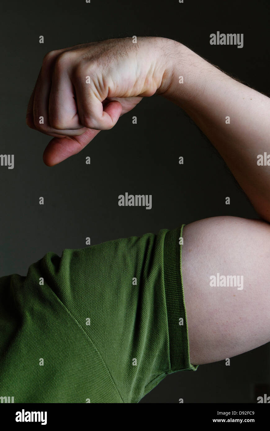A man shows his upper arm Stock Photo - Alamy