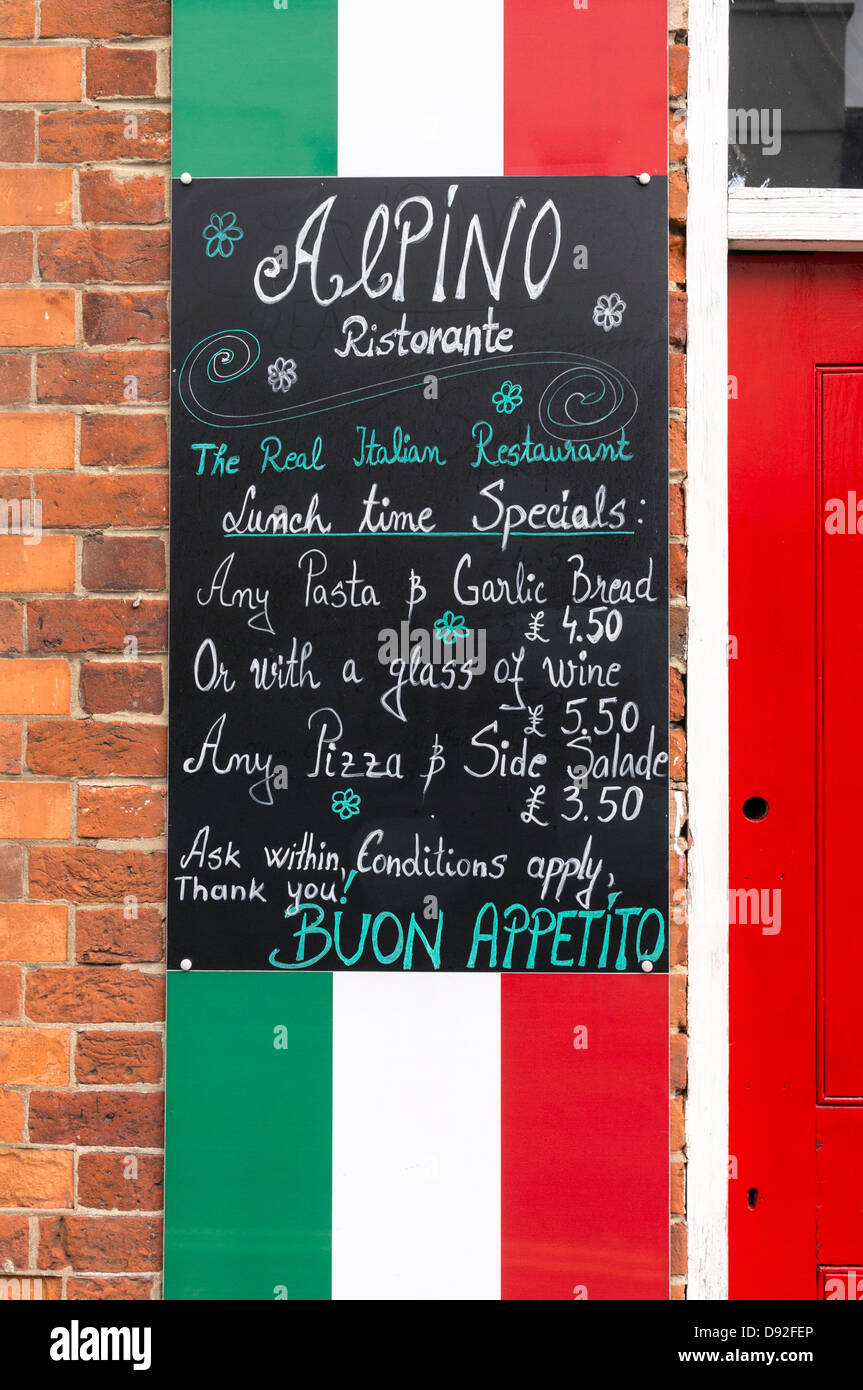 Menu written in chalk on blackboard outside Italian restaurant with ...