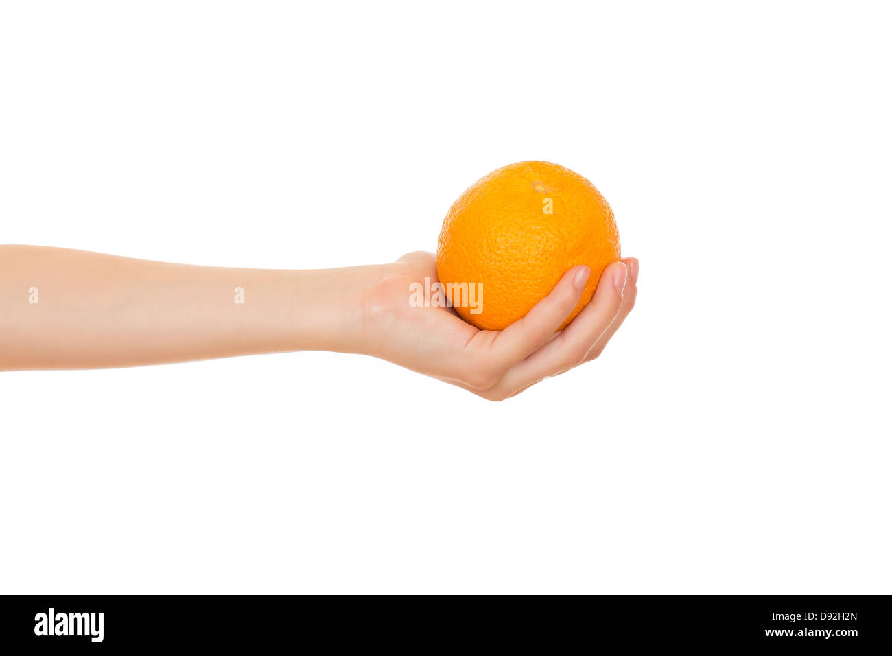 Orange in a child hand. Isolated on white background Stock Photo - Alamy