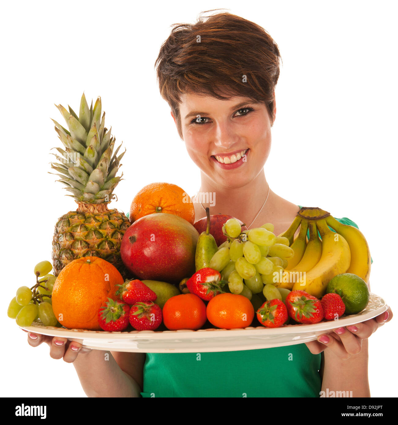 Pretty woman with assortment fresh fruit isolated over white background ...