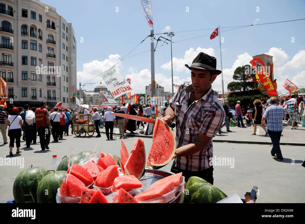 Istanbul, Turkey. June 9, 2013. Street vendor cut watermelon slices ...