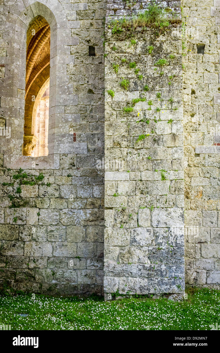 Medieval wall of white stone with a high window Stock Photo - Alamy