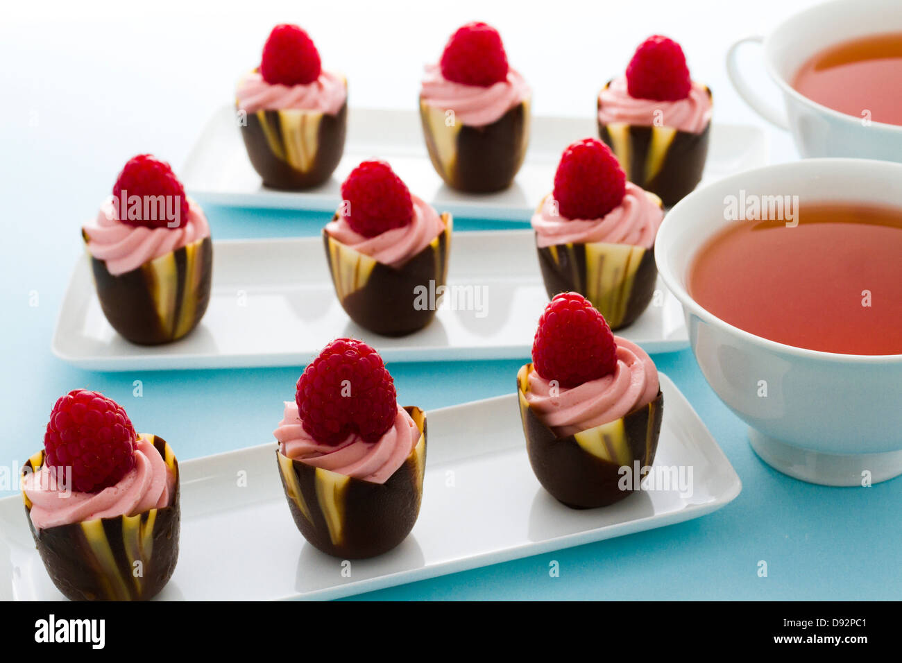 Small chocolate reaspherry tulip cups at dessert bar Stock Photo - Alamy