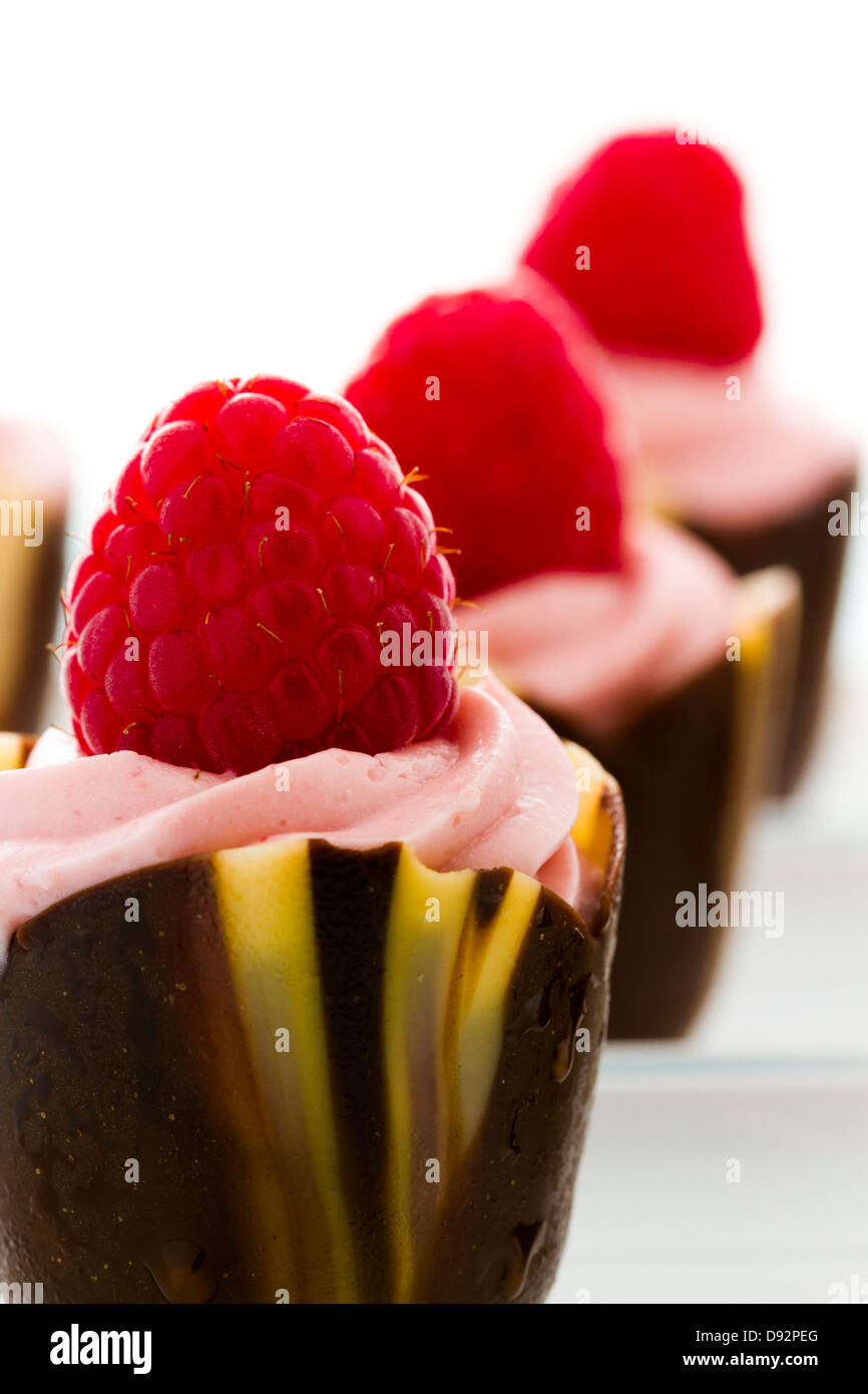 Small chocolate reaspherry tulip cups at dessert bar Stock Photo - Alamy
