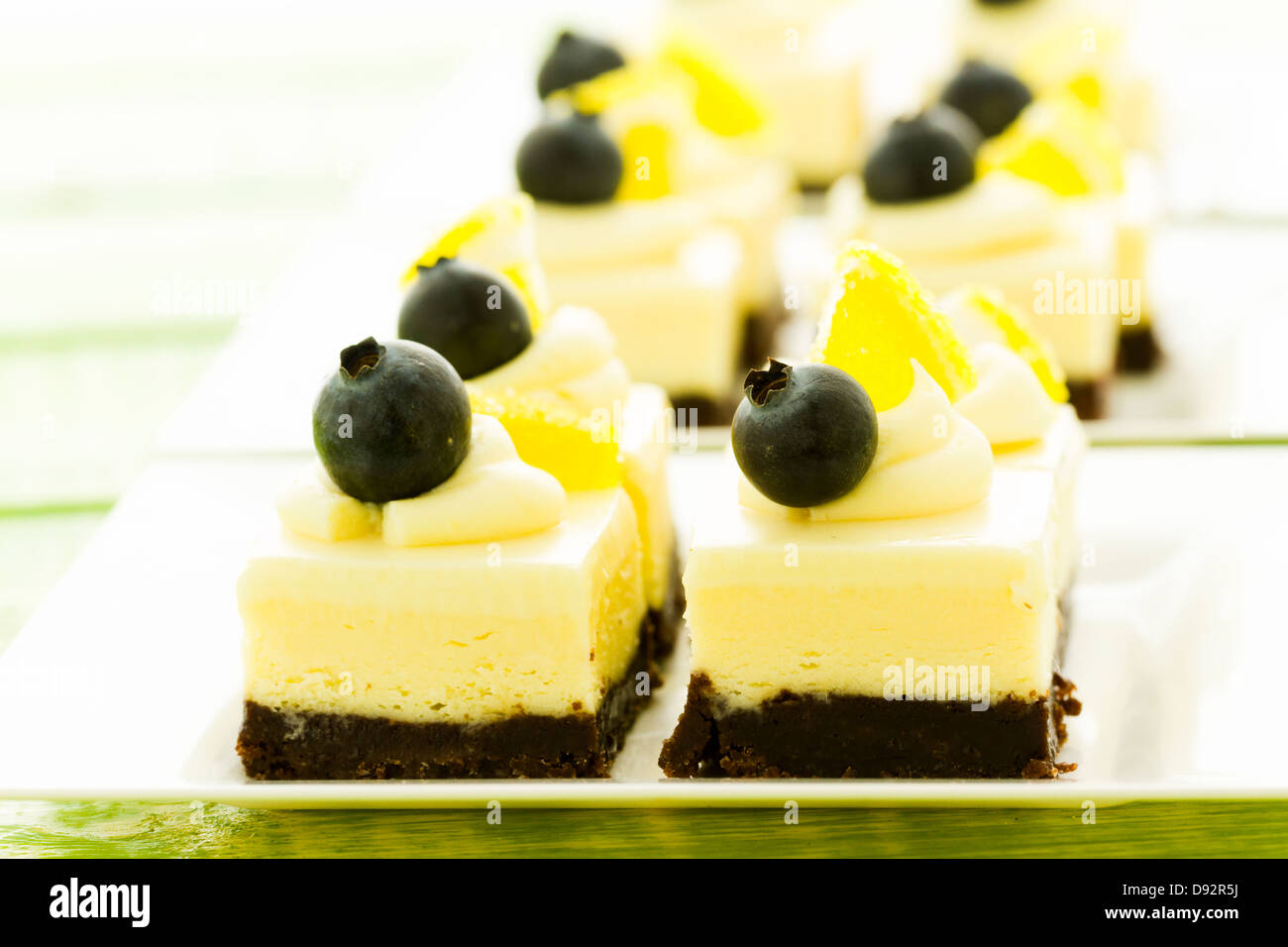 Small white chocolate cheesecake squares at dessert bar Stock Photo - Alamy