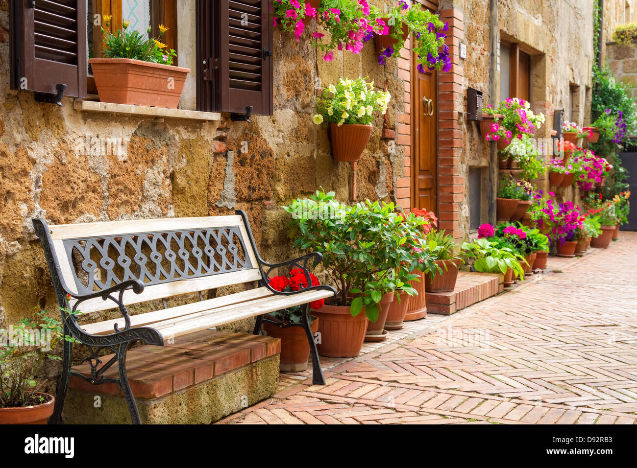 Beautiful street decorated with flowers in Italy Stock Photo - Alamy