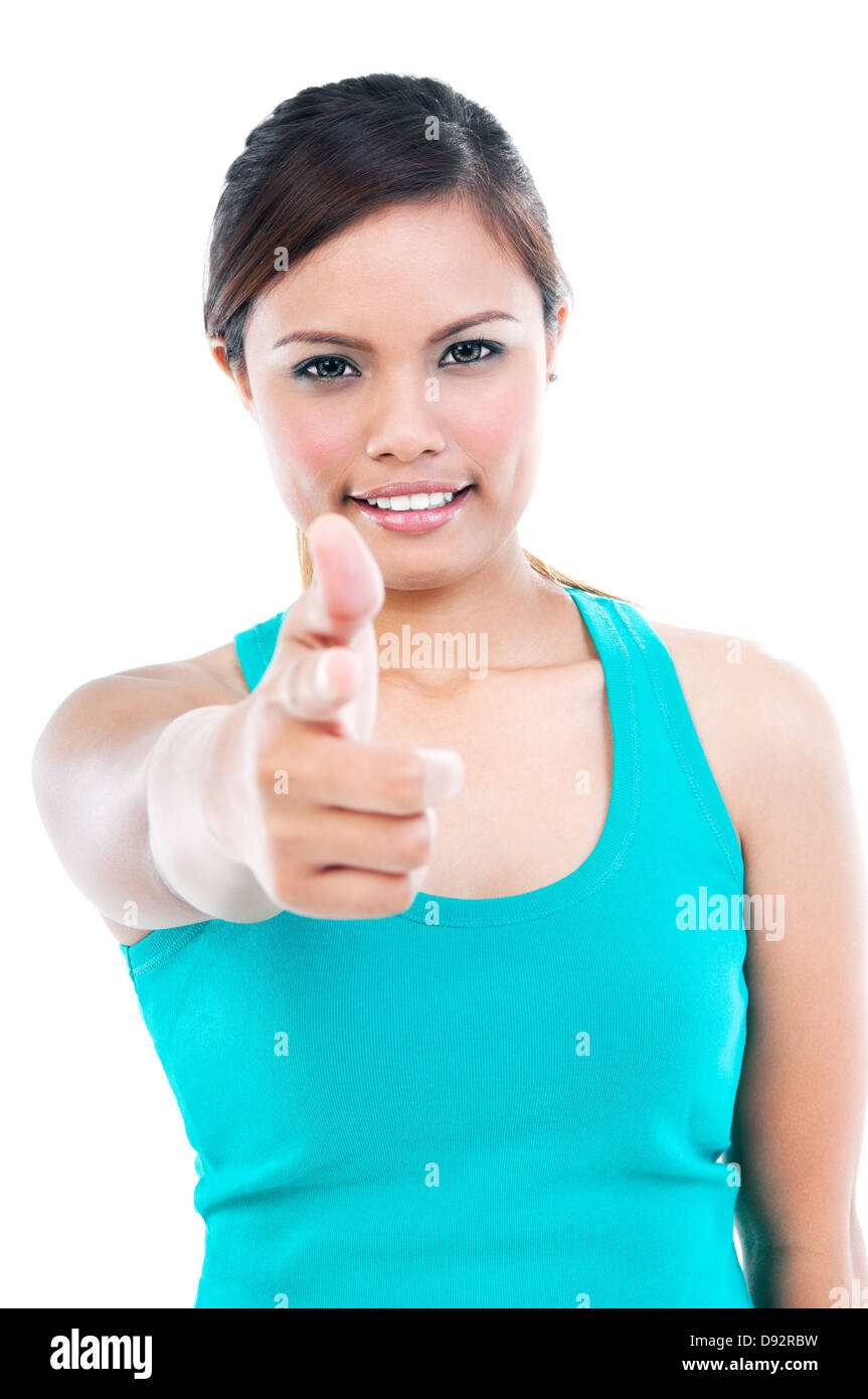 Pretty young woman finger pointing at camera, portrait Stock Photo - Alamy