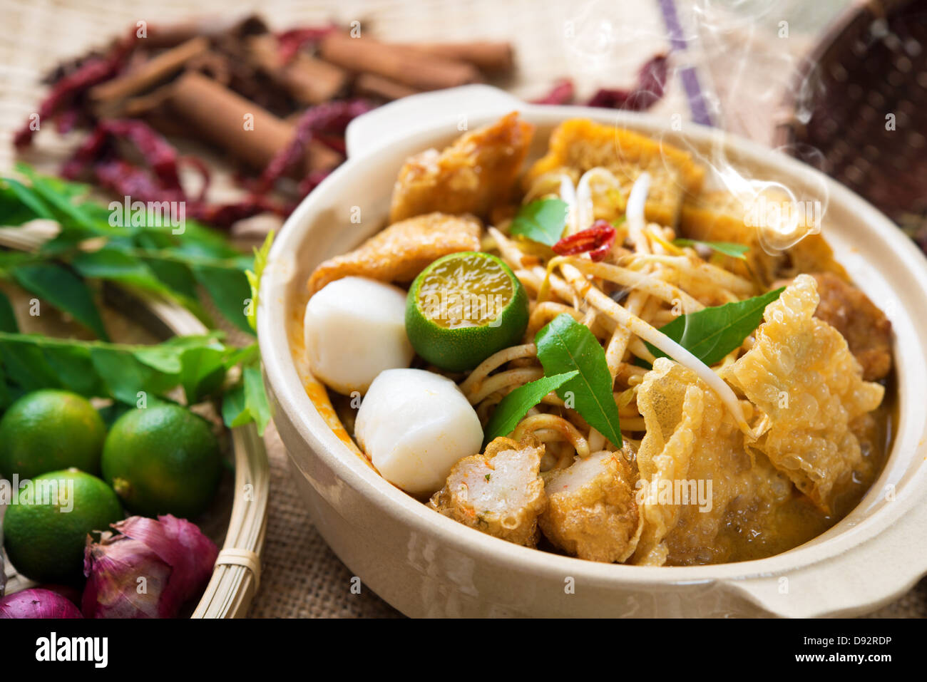 Hot and spicy Malaysia Curry Noodle or laksa mee with hot steam in clay ...