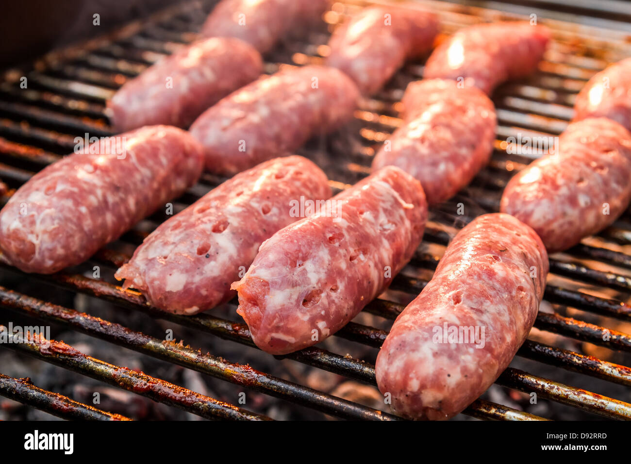 BBQ with fiery sausages on the grill Stock Photo - Alamy