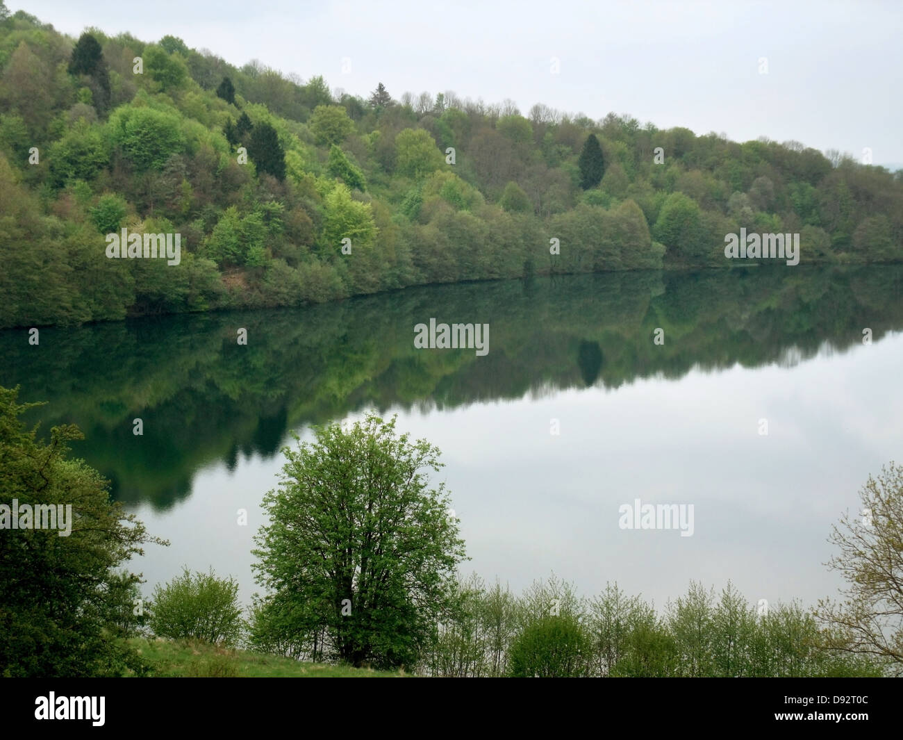 idyllic scenery showing a maar in the Vulkan Eifel, wich is a region in ...