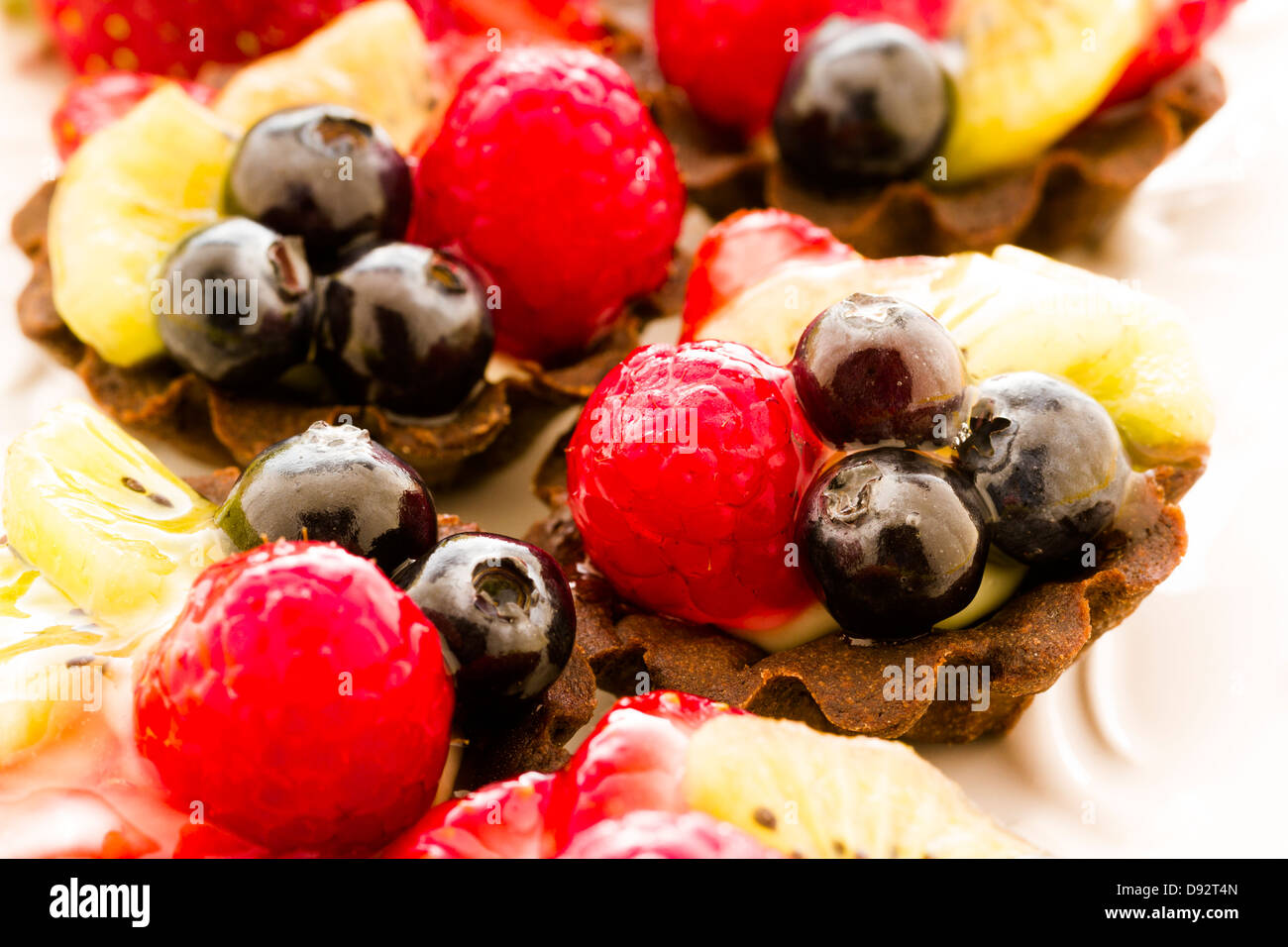 Small fresh fruit tartlets at dessert bar Stock Photo - Alamy
