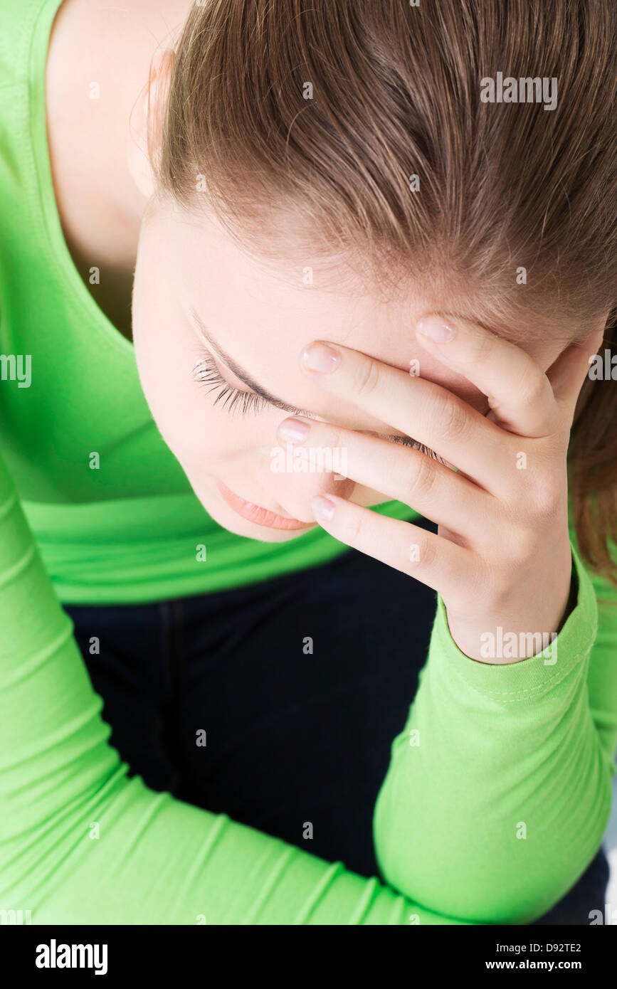 Young sad woman, have big problem or depression, over white background ...