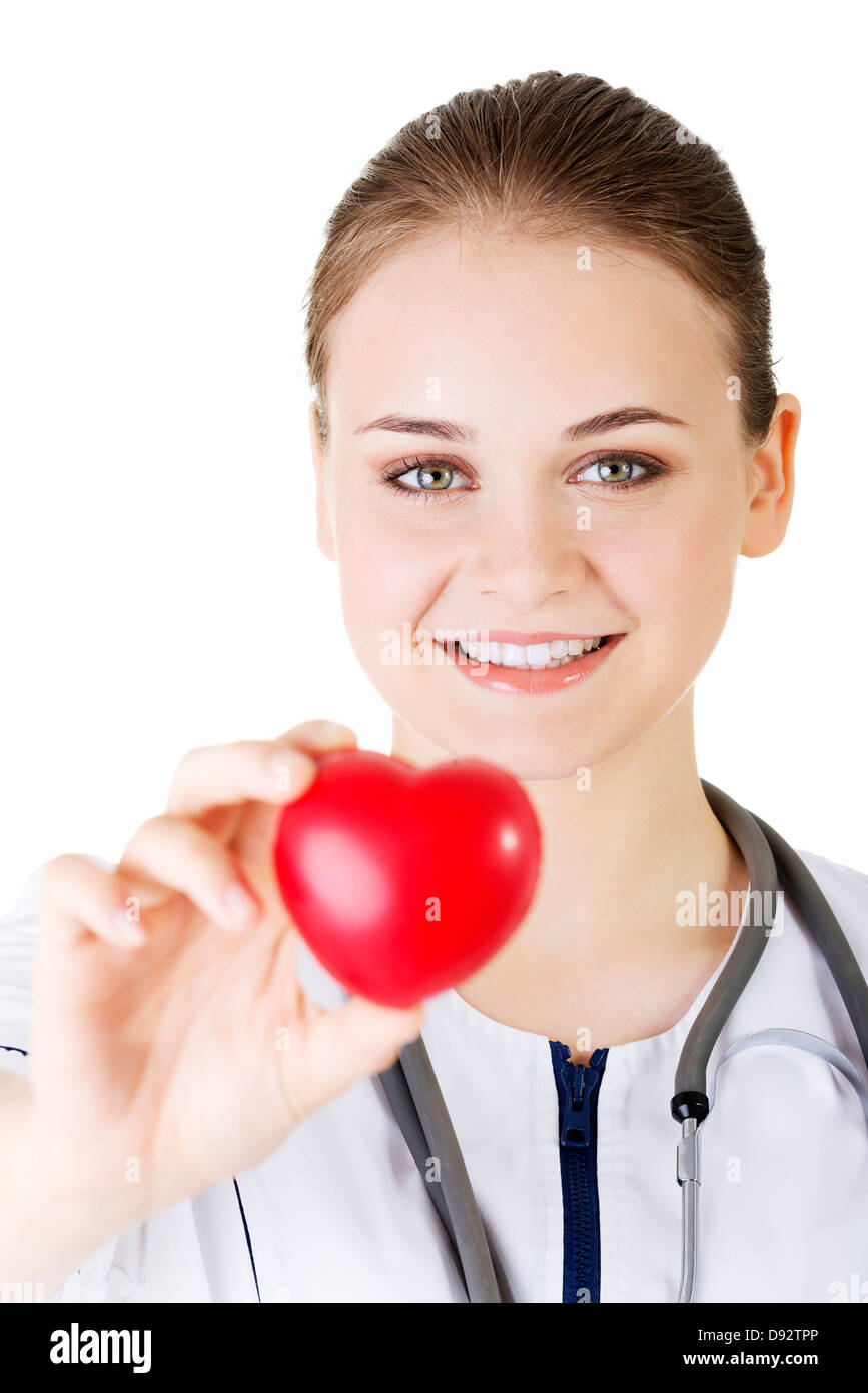 Young nurse with heart in her hand , isolated on white Stock Photo - Alamy