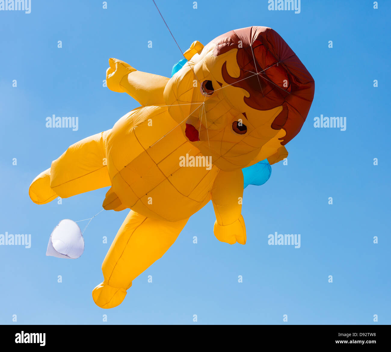 Baby kite against vibrant blue sky Stock Photo - Alamy