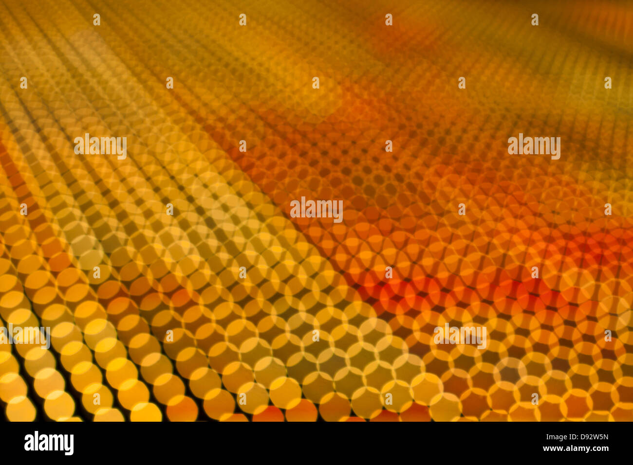 Yellow and orange circular light pattern Stock Photo - Alamy