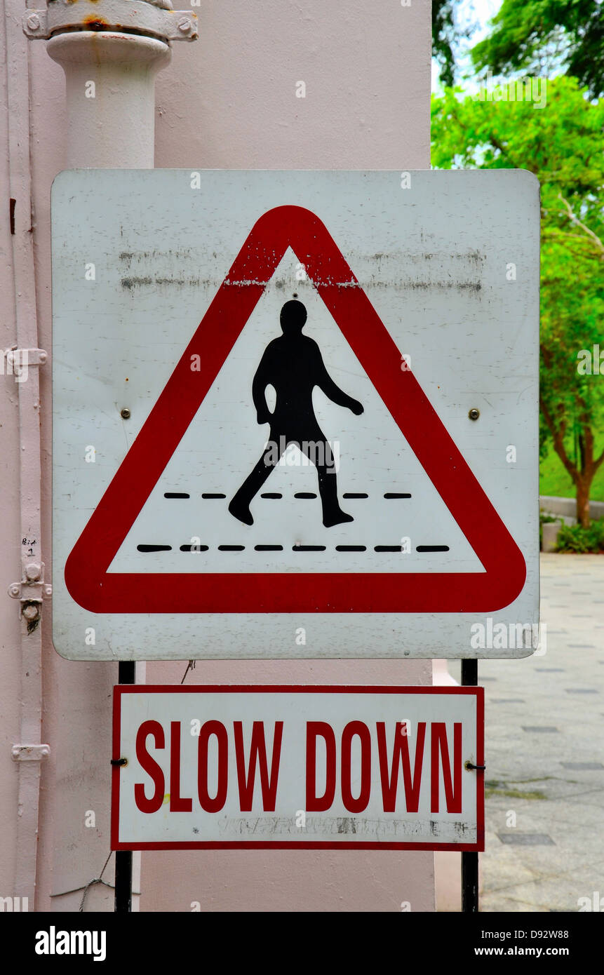 Pedestrian warning sign: Slow Down Stock Photo - Alamy