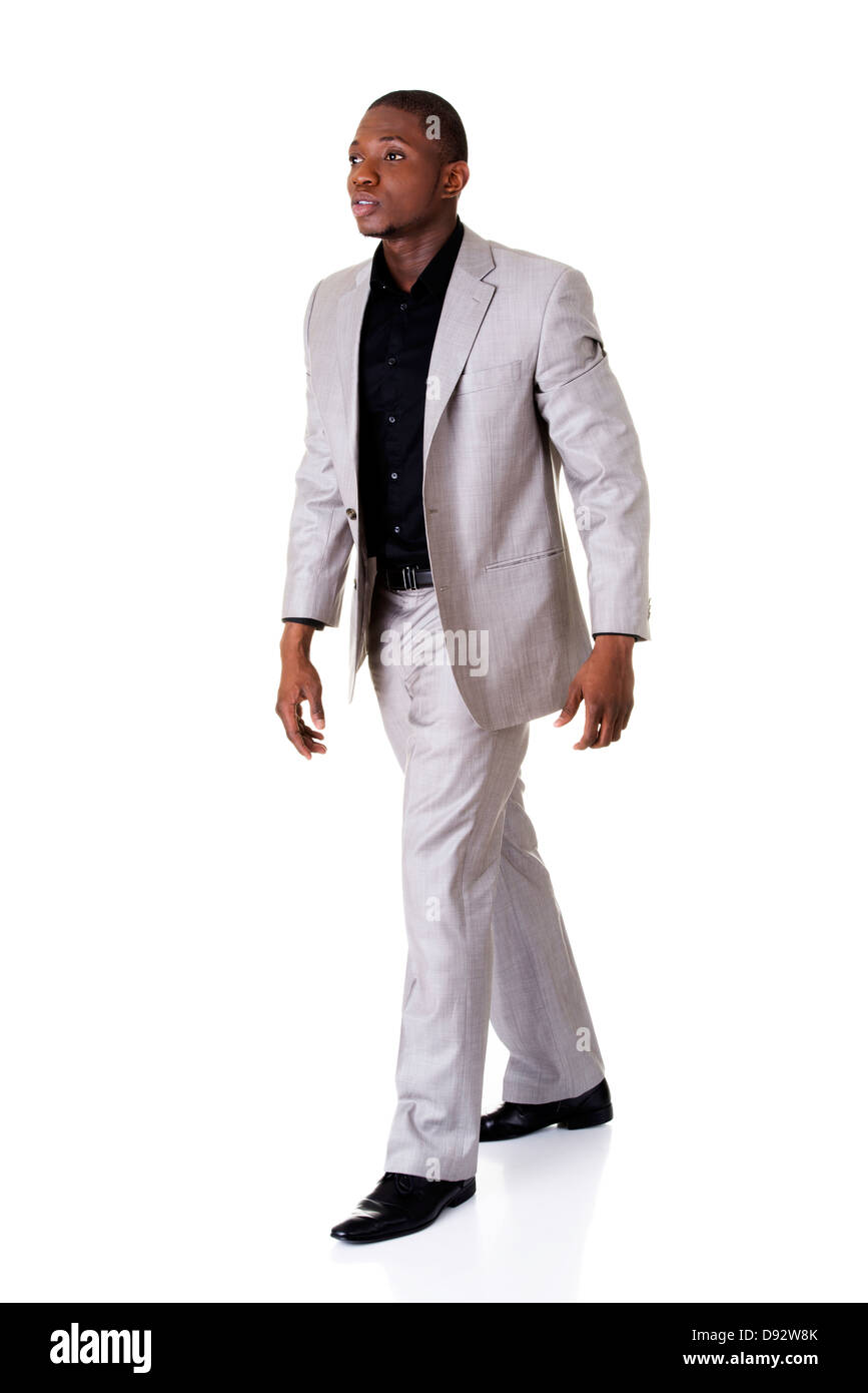 A young businessman is walking. Isolated over white background Stock ...