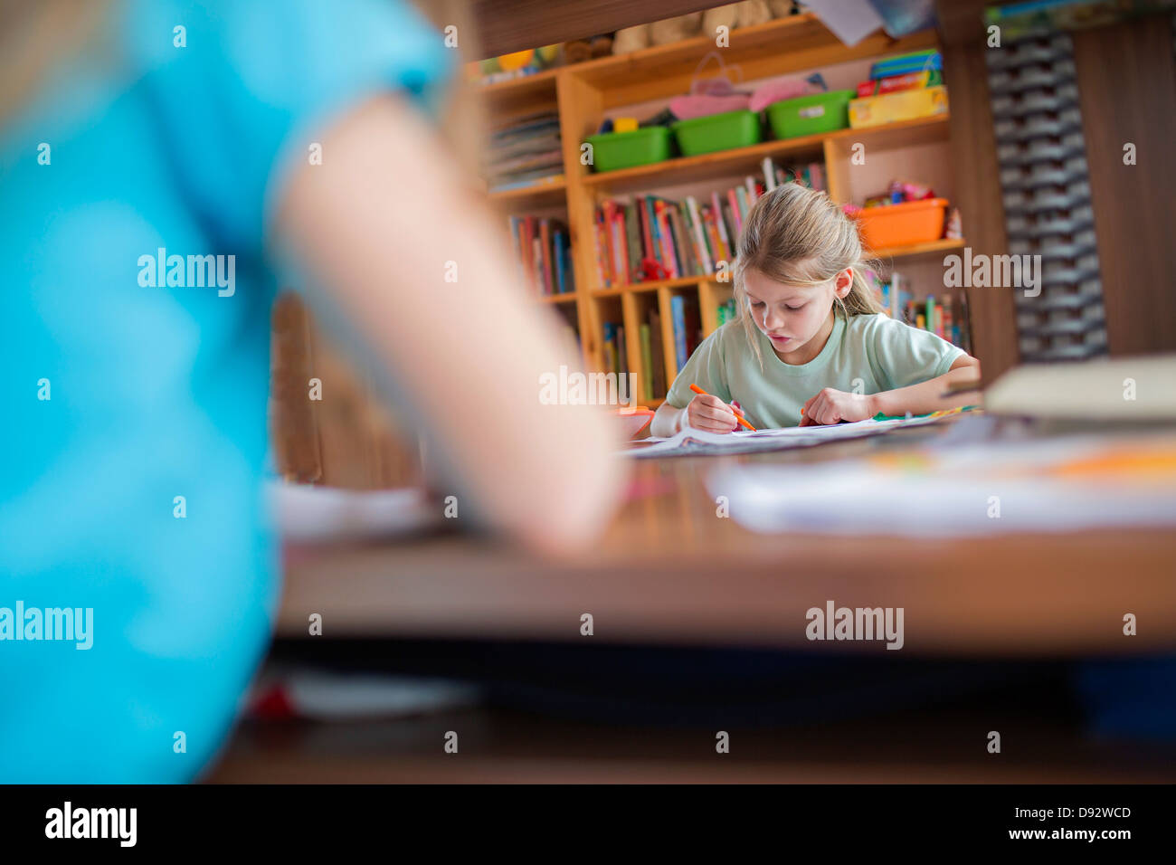 Two girls doing homework Stock Photo - Alamy