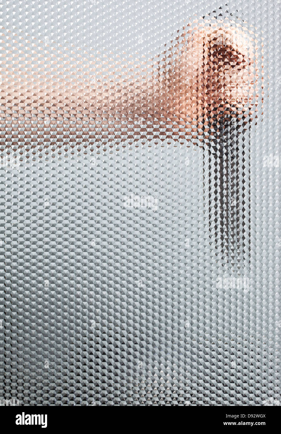 A human hand holding a knife behind a beveled glass window Stock Photo ...