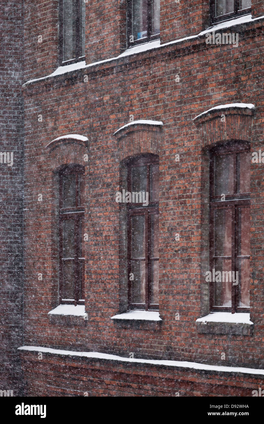 The exterior of a brick building during a blizzard Stock Photo - Alamy