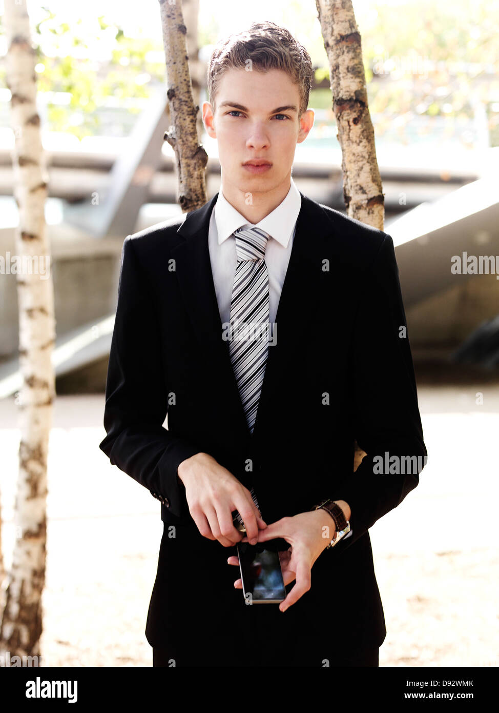 Portrait serious young businessman looking hi-res stock photography and ...