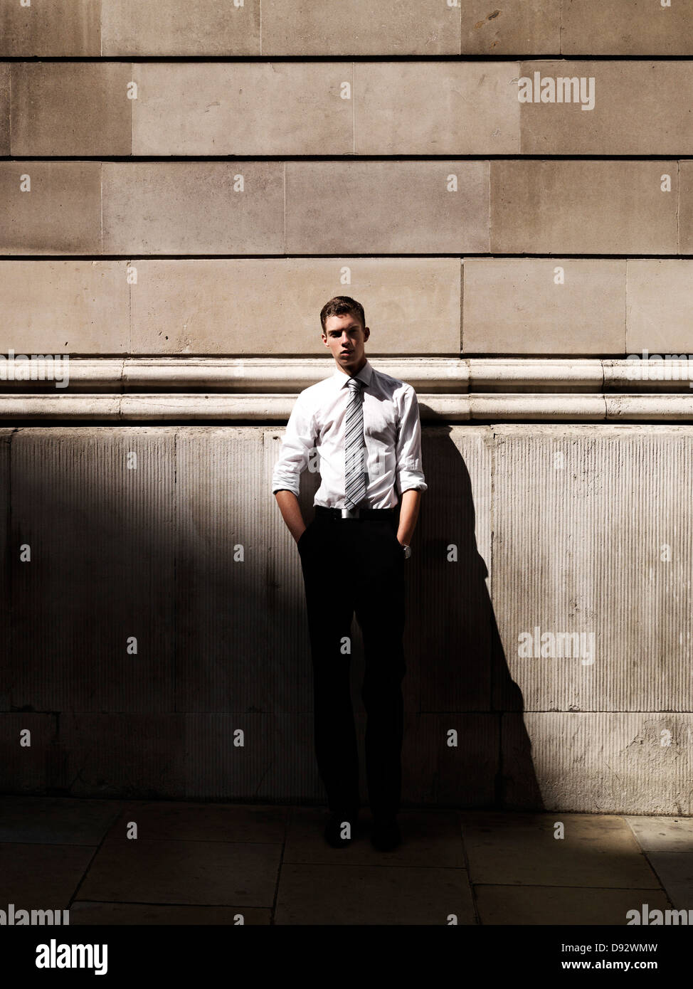 Businessman standing in front of a building hi-res stock photography ...