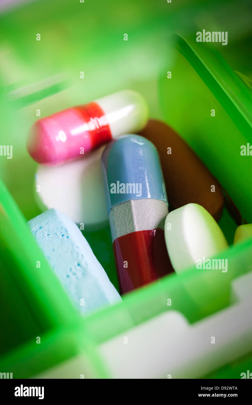 A heap of pills in an open pill organizer, close-up, full frame Stock ...