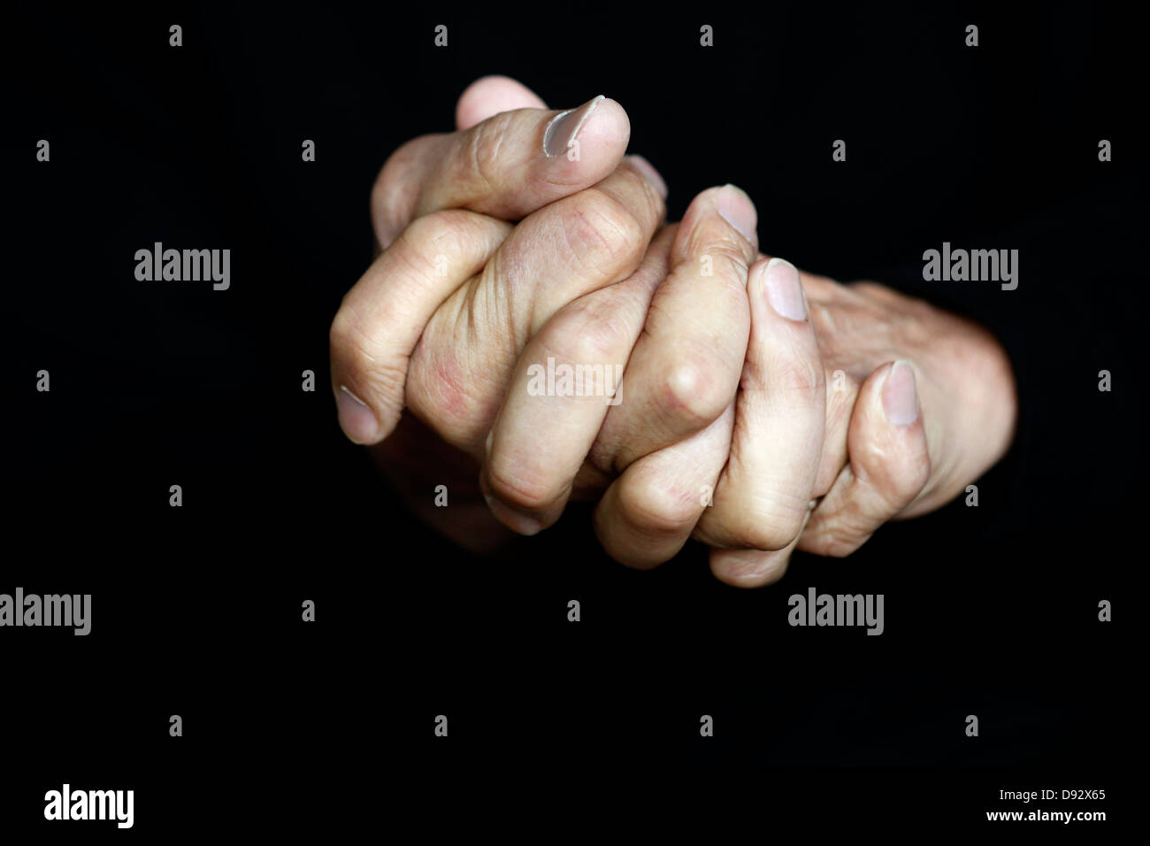 Close-up of clasped hands Stock Photo - Alamy