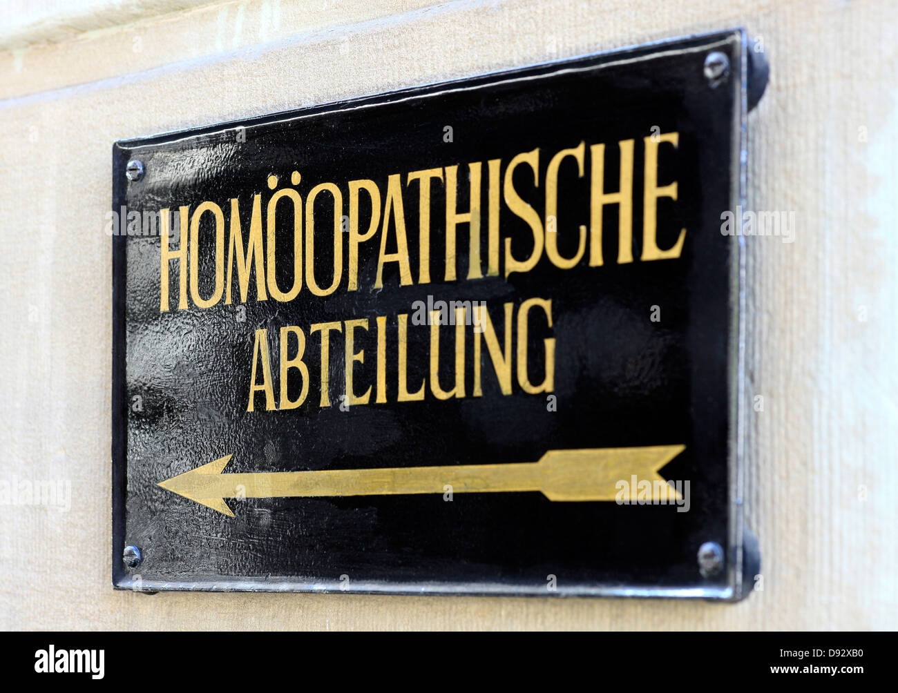 Metal plaque reading 'Homeopathic department' in German Stock Photo - Alamy